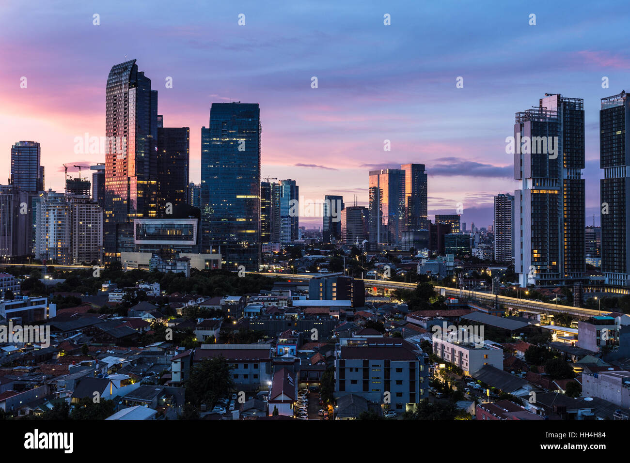Aerial view of sunrise over the Kuningan business district of Jakarta ...
