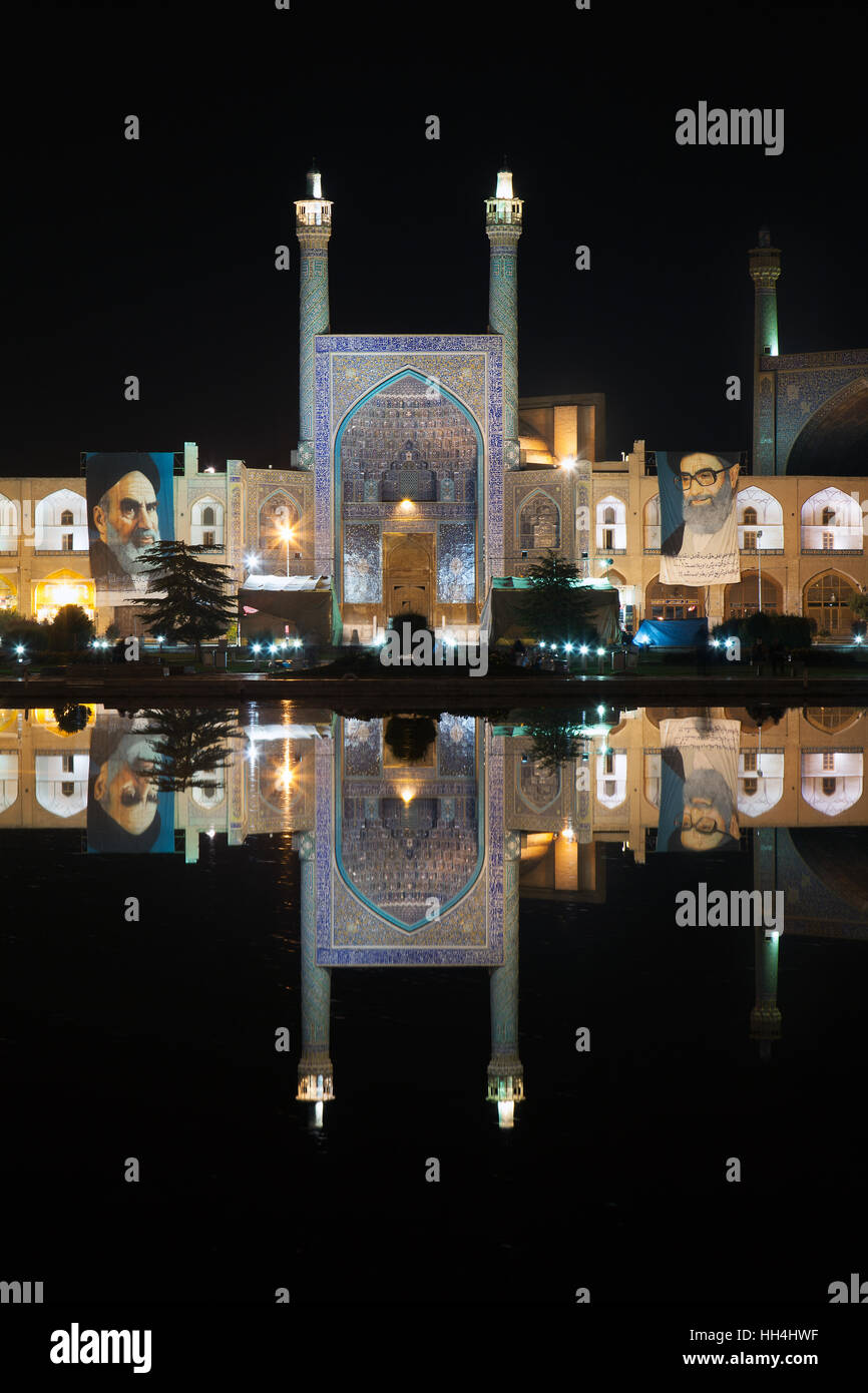 Imam mosque ( also known as Shah mosque ) reflected in a pool by night ...