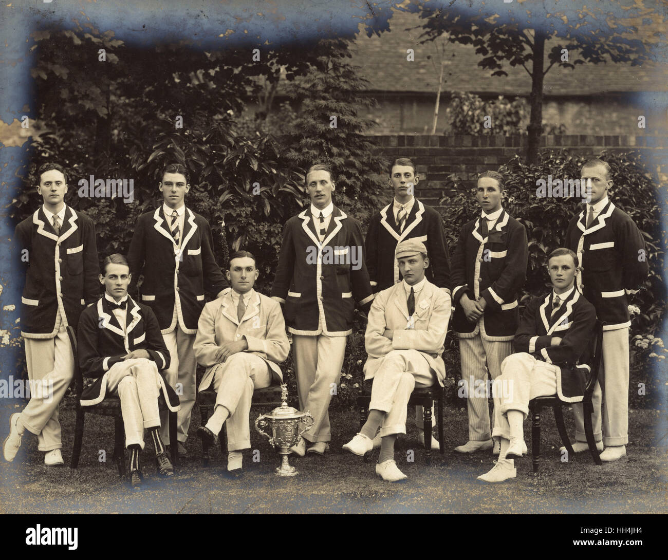 Rowing crew from Cambridge University posing for a team photograph with ...