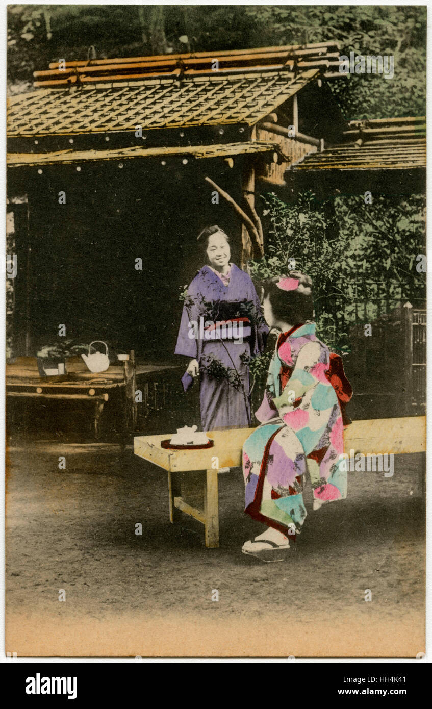 A Japanese Geisha girl taking tea in a garden Stock Photo - Alamy