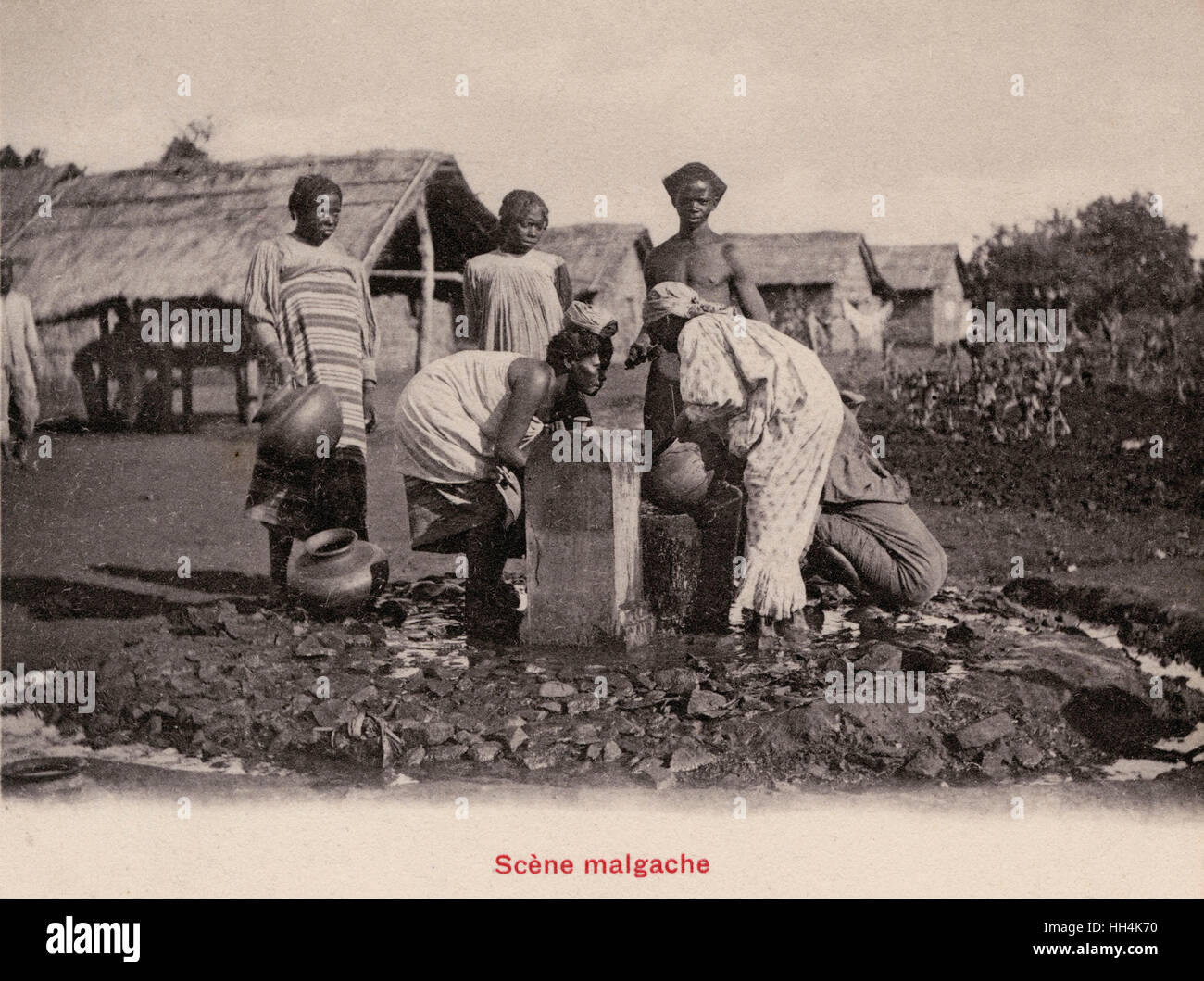 Madagascan women gathering water from a fountain Stock Photo - Alamy