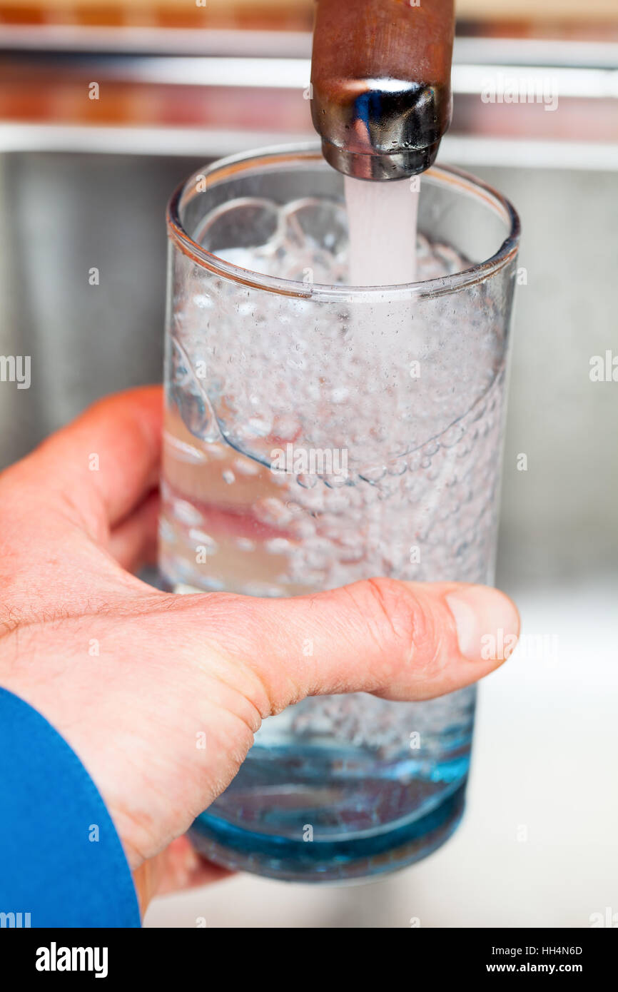 Water pouring from faucet sink hi-res stock photography and images - Alamy