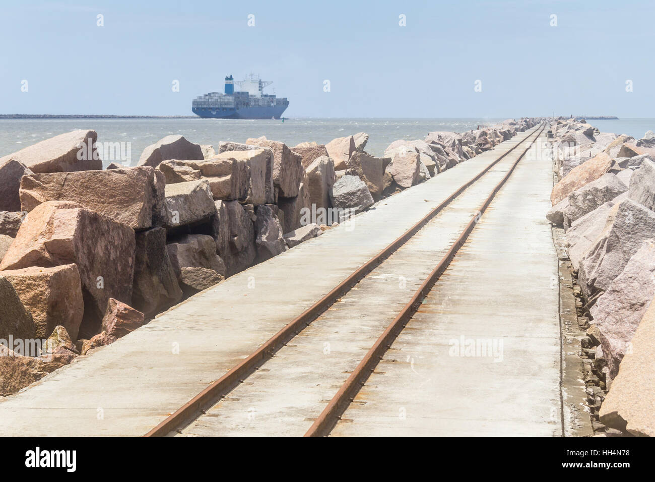 Ship navigating to the ocean using Rio Grande channel and breakwater at ...