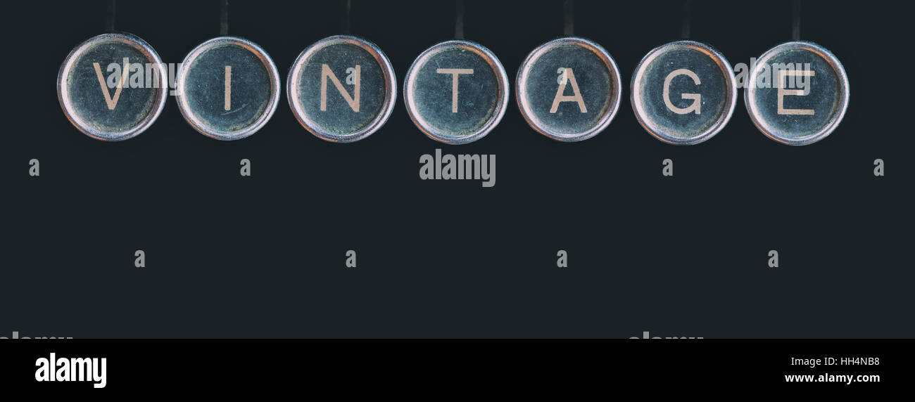 Vintage word made with printer keys on the black background. Horizontal ...