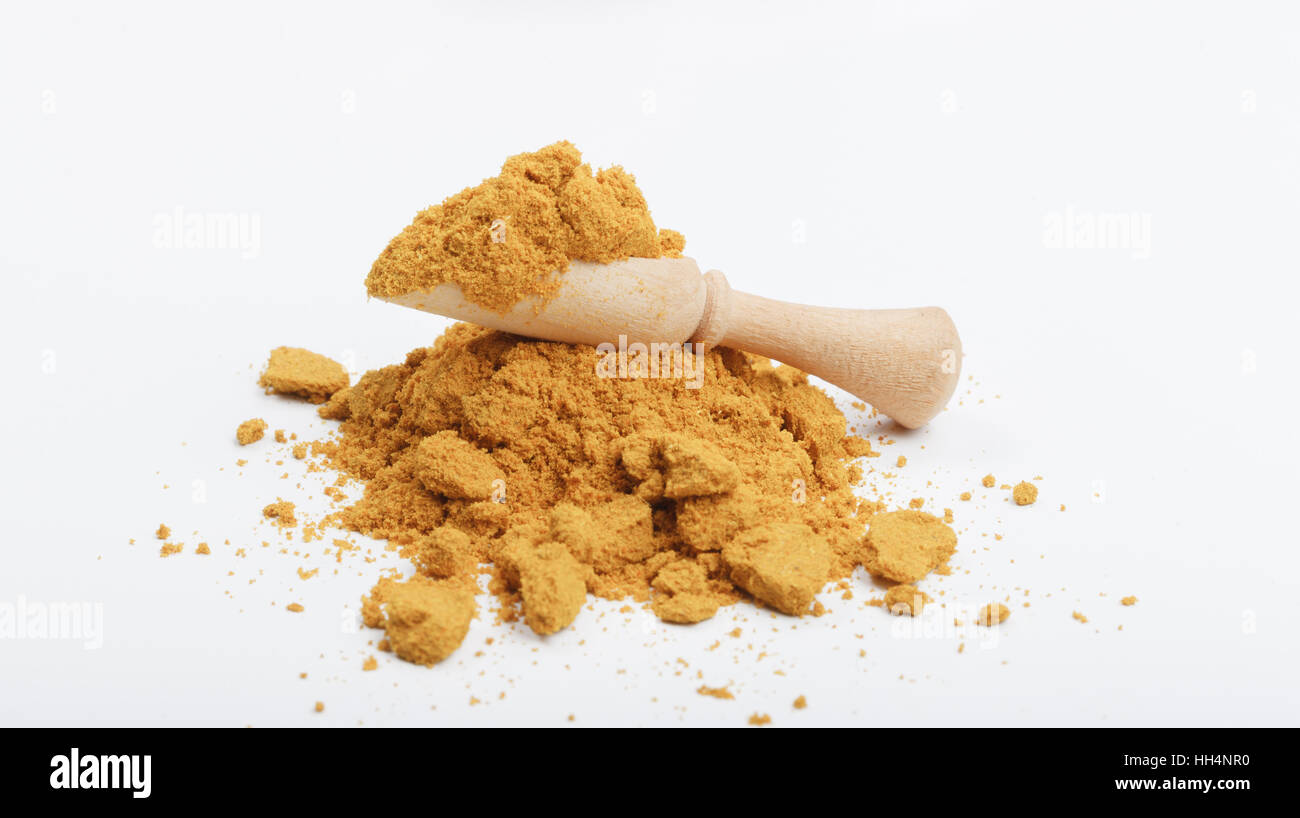 Aromatic yellow color curry powder ingredient on white table with ...