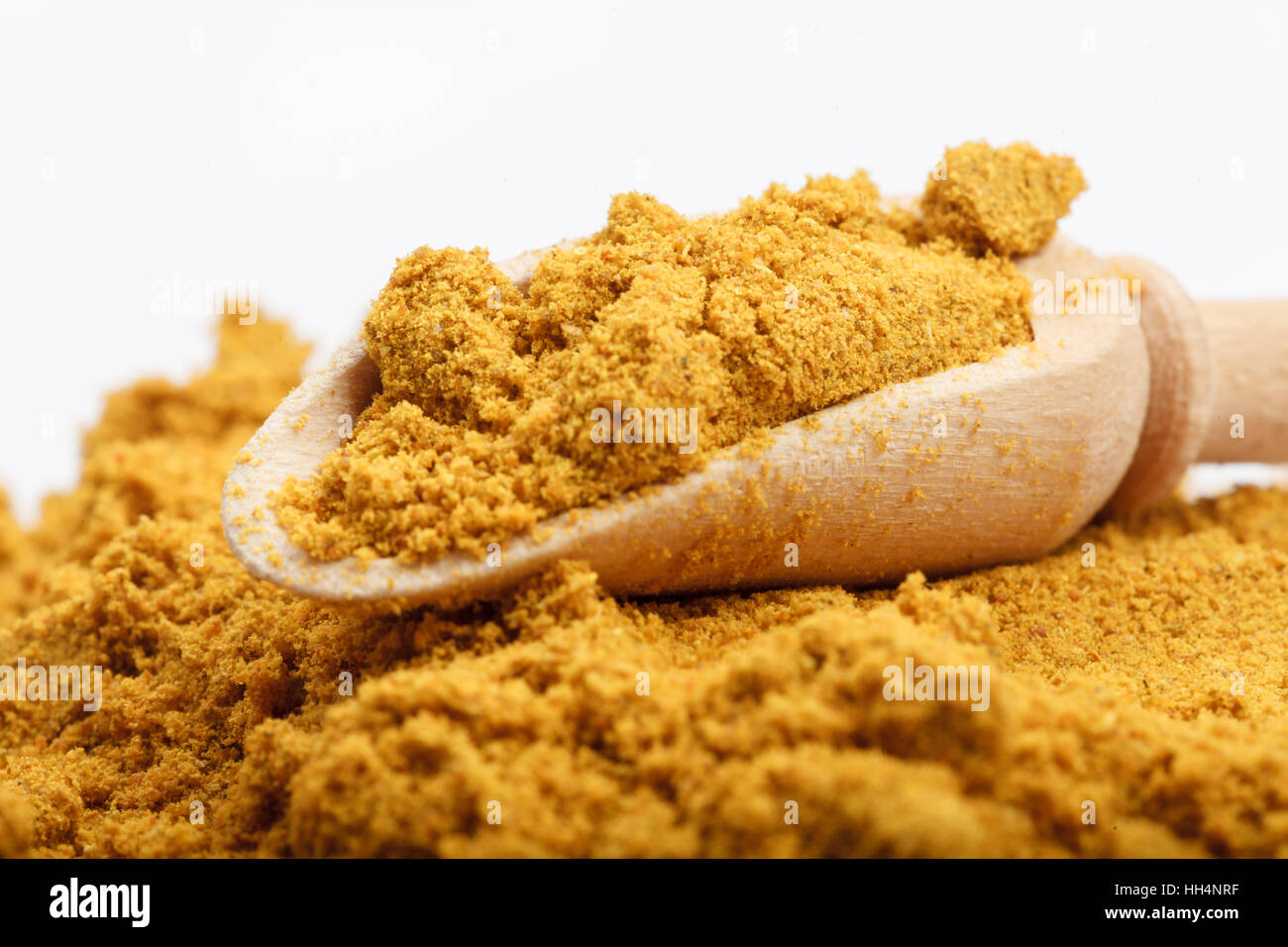 Aromatic yellow color curry powder ingredient on white table with ...