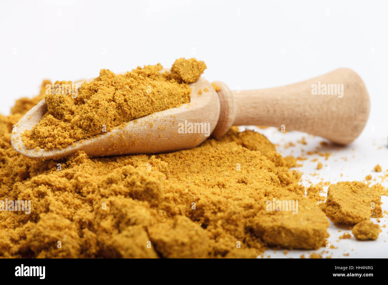 Aromatic yellow color curry powder ingredient on white table with ...