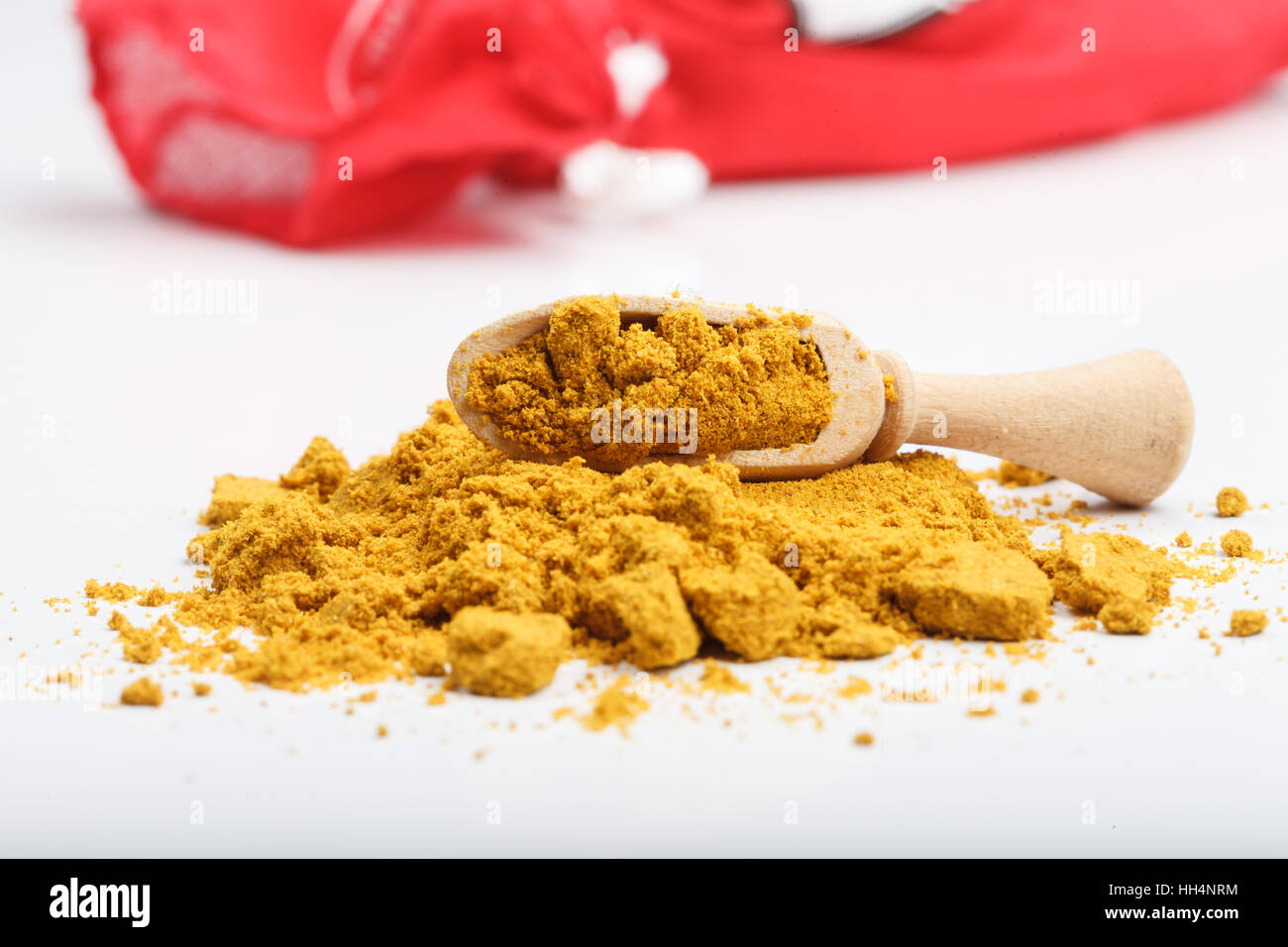 Aromatic yellow color curry powder ingredient on white table with ...