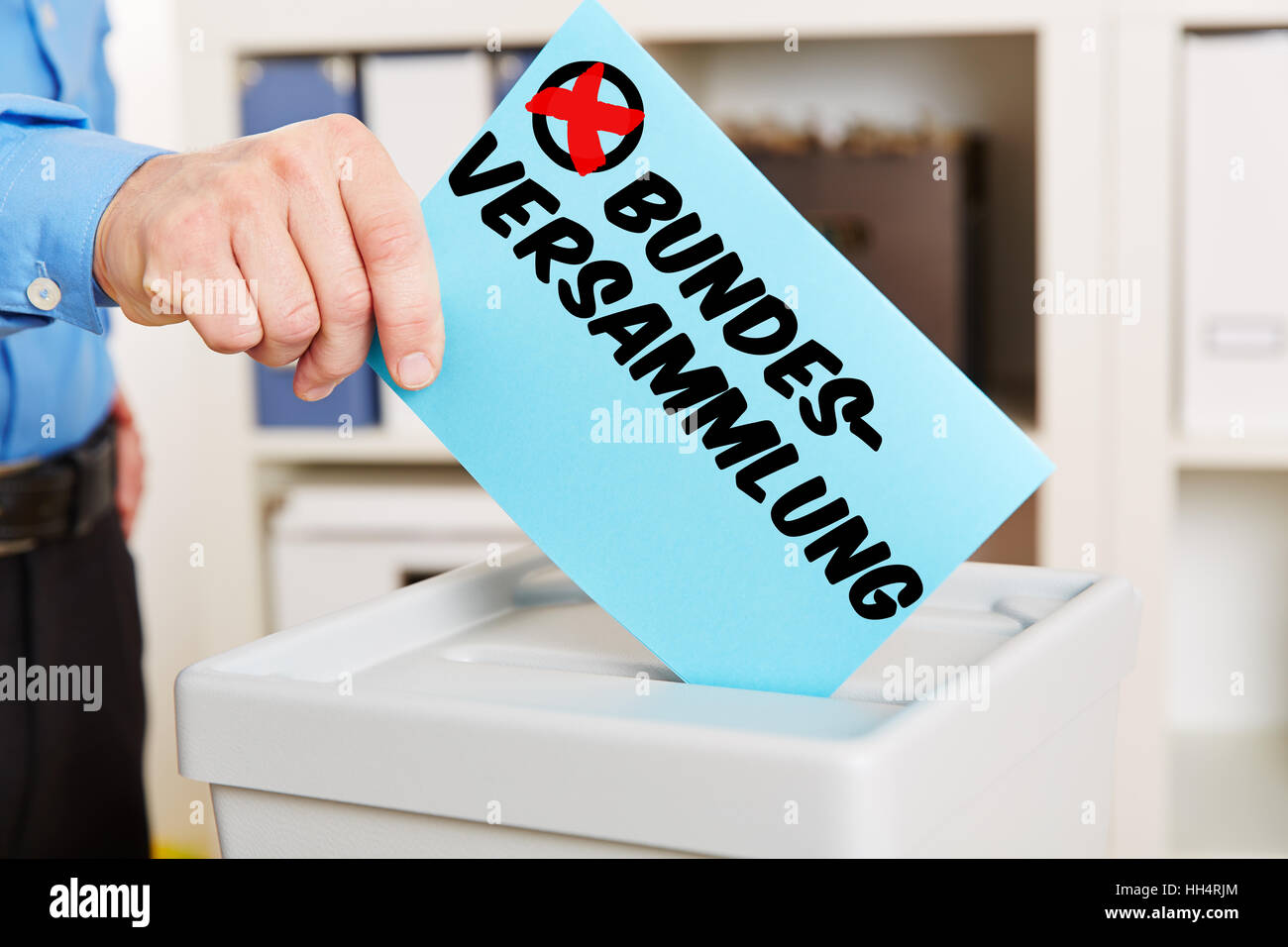 Hand introducing ballot paper with german word "Bundesversammlung ...
