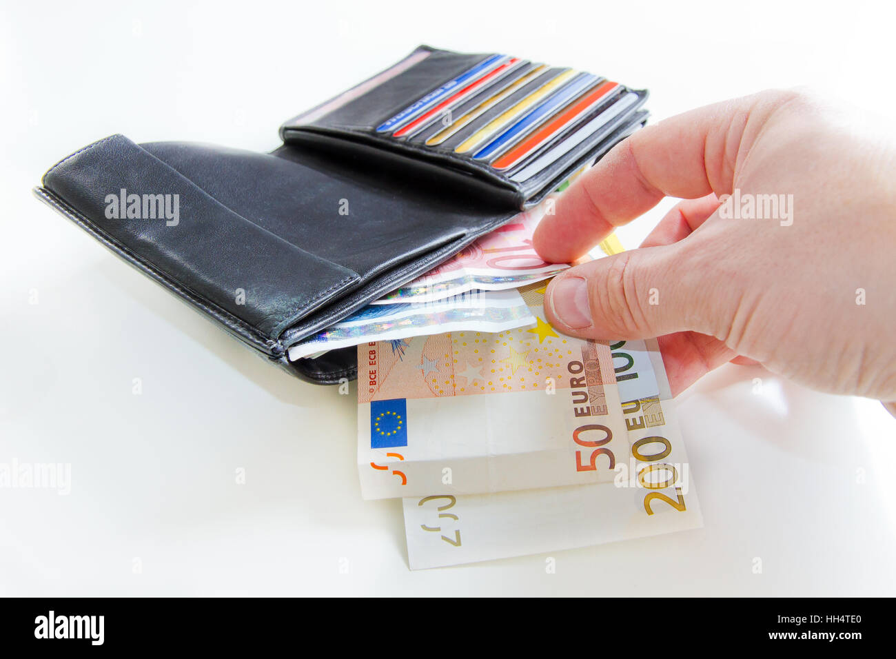 Hand with money pocket Stock Photo - Alamy