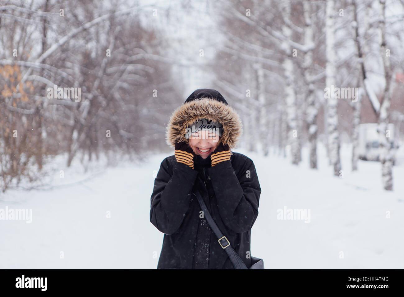 Winter fashion. Portrait of a beautiful young woman in warm clothes ...