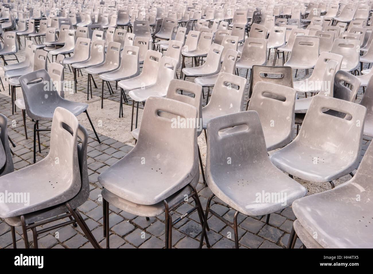 Gray chairs on pavement Stock Photo - Alamy