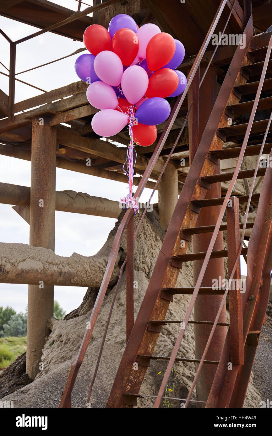Color balloons on rusty staircase Stock Photo - Alamy