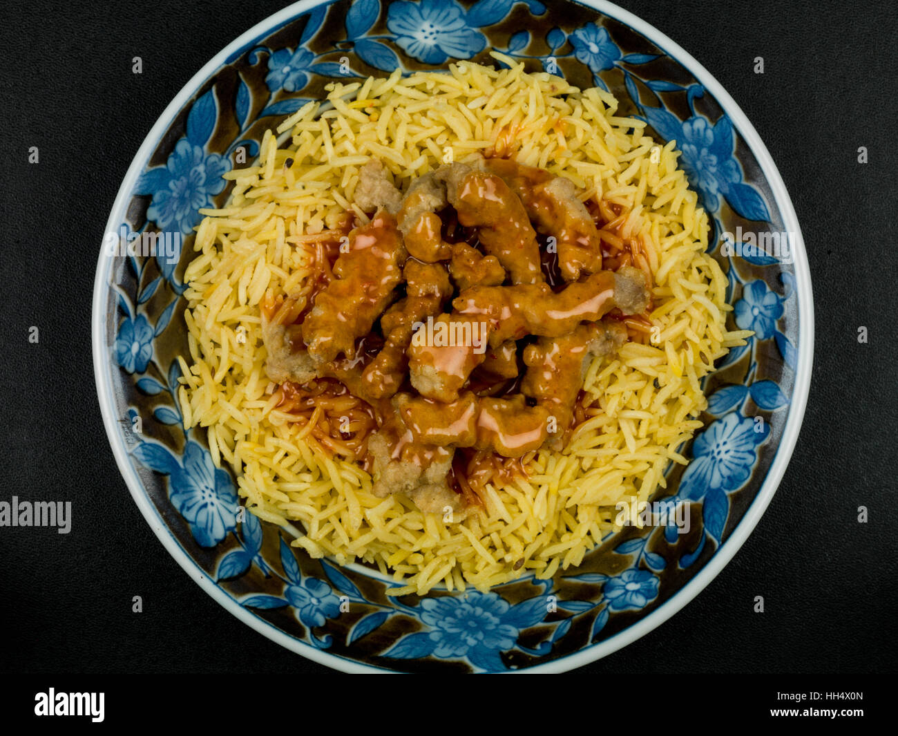 Chinese Style Food Crispy Beef Served With Fried Rice Stock Photo - Alamy