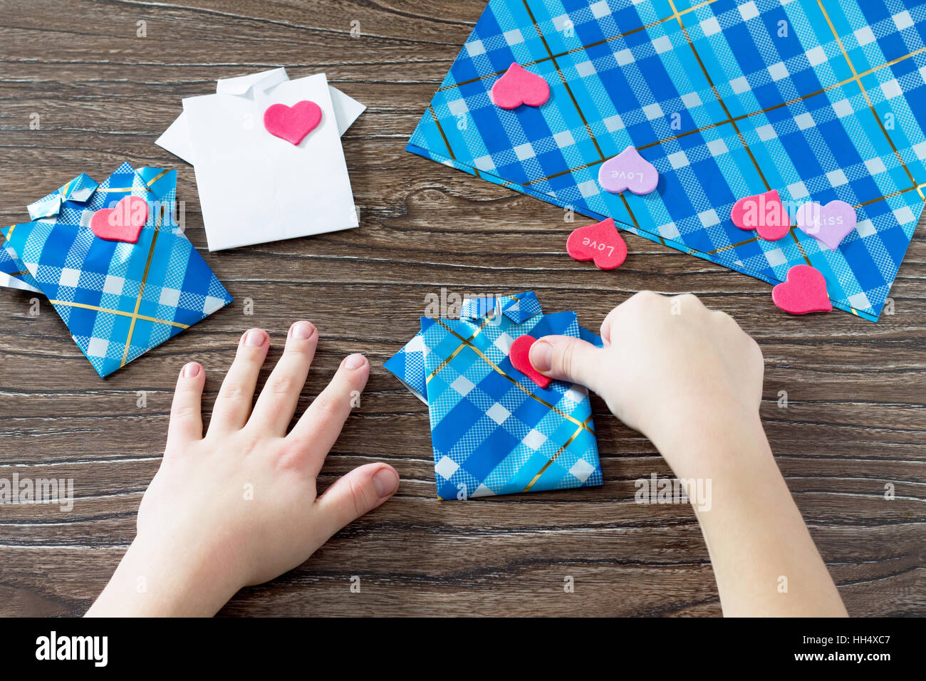 Gift for Father's Day background, copy space. A child holding a gift ...