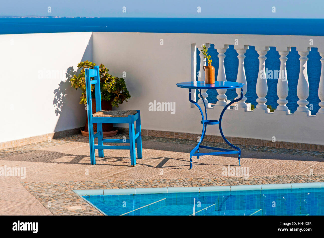 table and chair beside water pool Stock Photo - Alamy