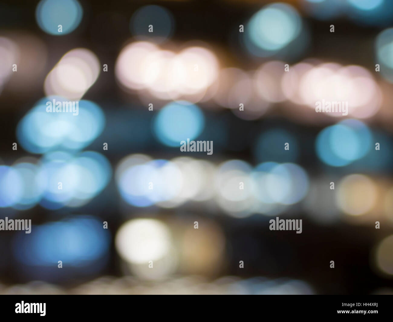 Blurred window of the multi-storey building office lighting. Blur ...