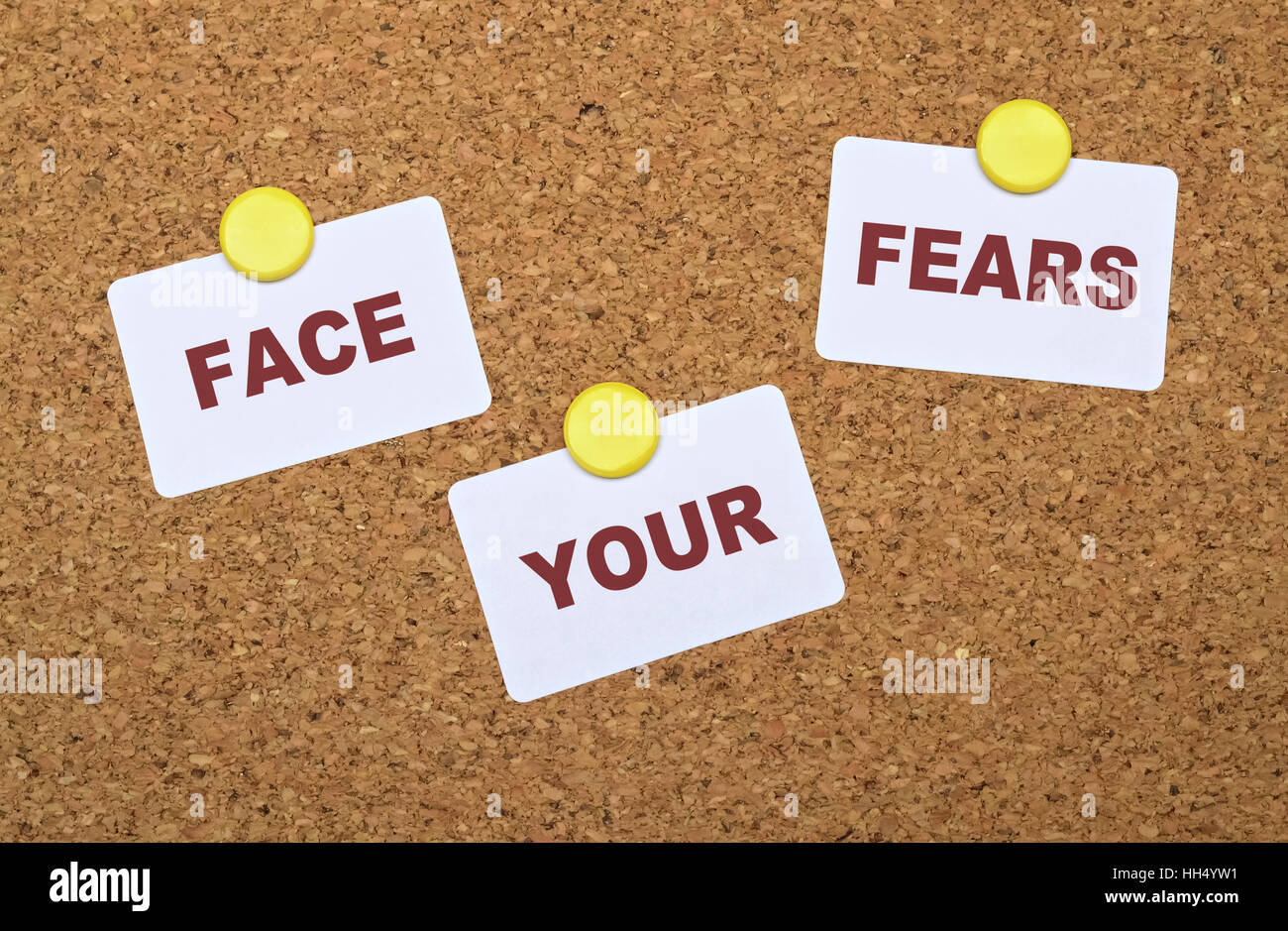 Text Face Your Fears on white stickers pinned on cork board Stock Photo ...