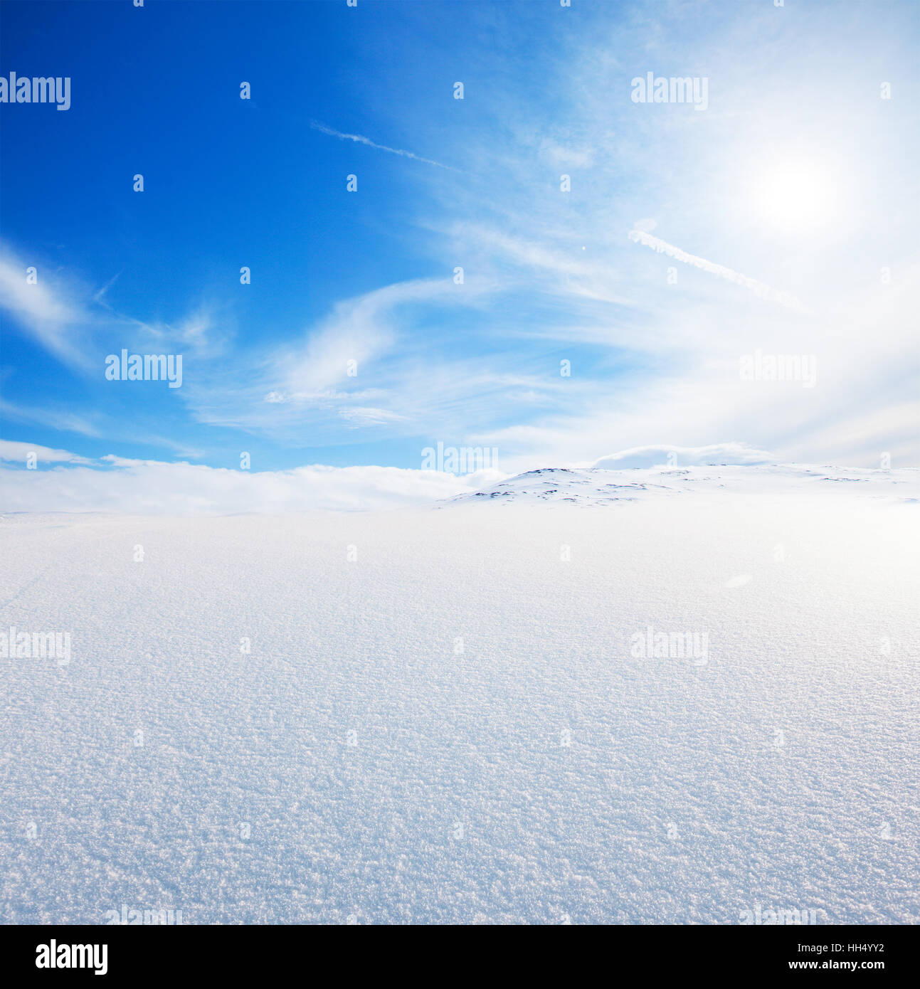 snow hill and blue sky Stock Photo - Alamy