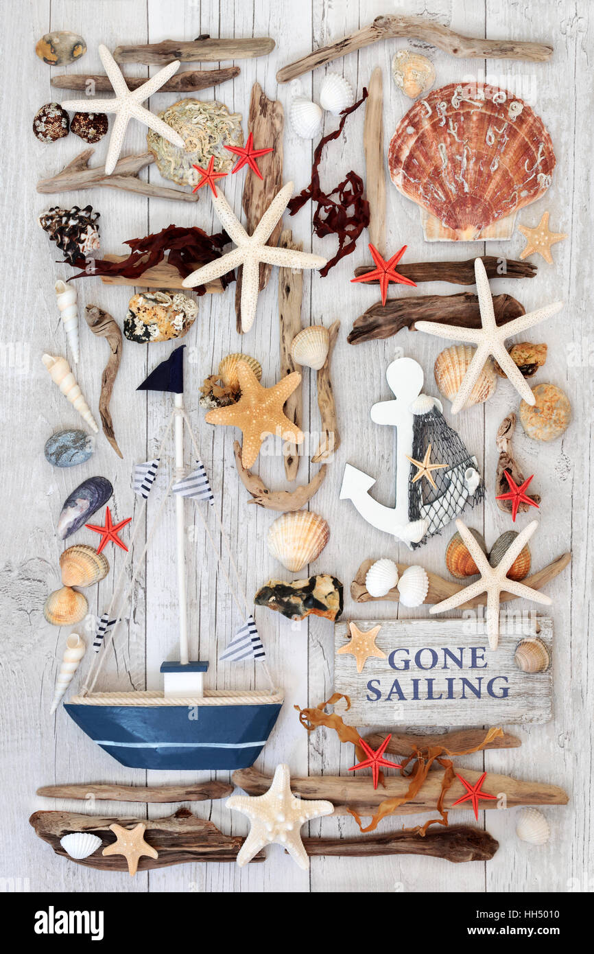 Sailing themed seaside abstract with decorative rustic wooden boat and ...