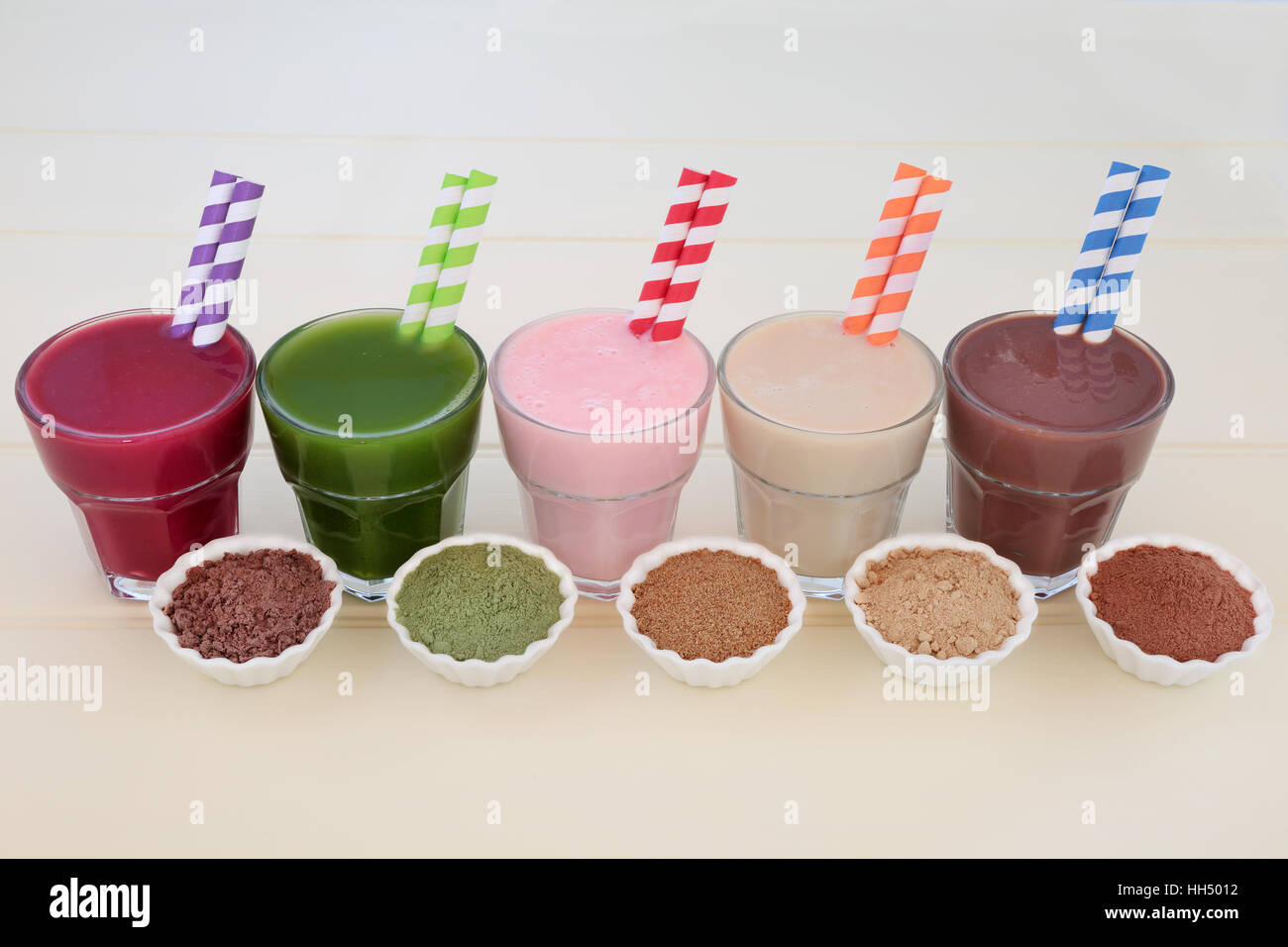 Health food drinks with corresponding powders of acai berry, wheat ...