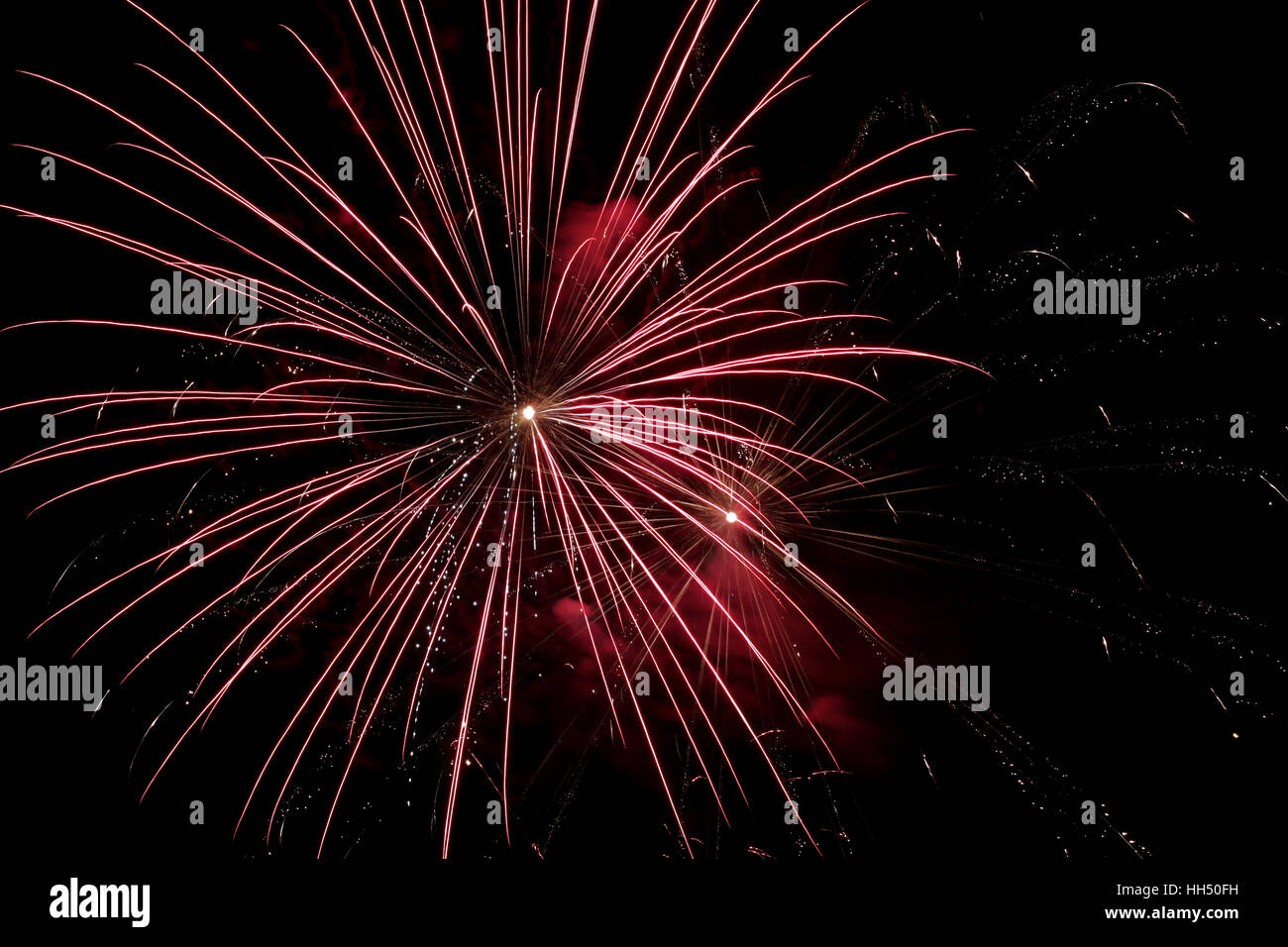 Colorful fireworks explosion in a dark night Stock Photo - Alamy