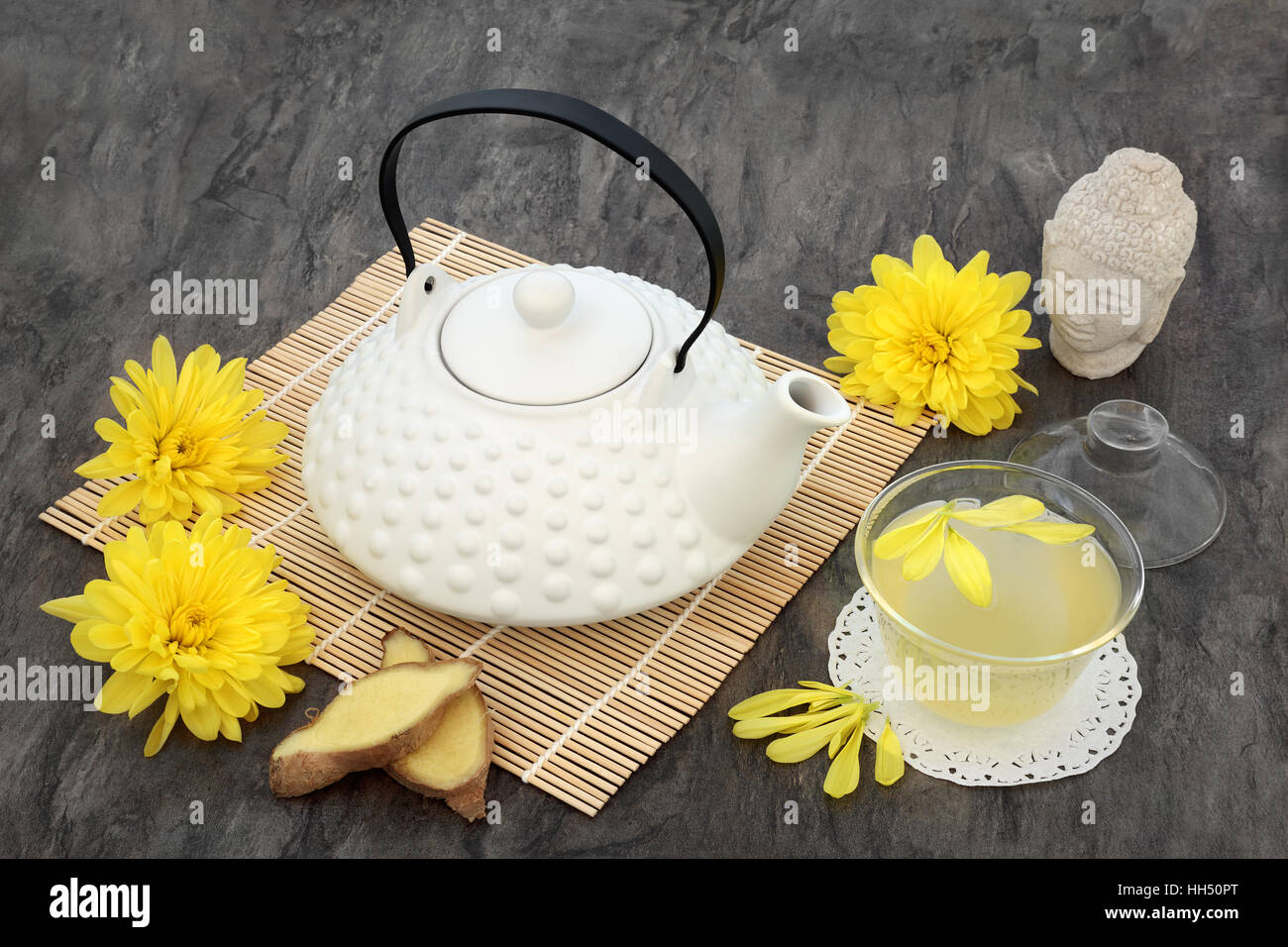 Chrysanthemum flower tea with fresh flowers, oriental teapo, glass cup ...