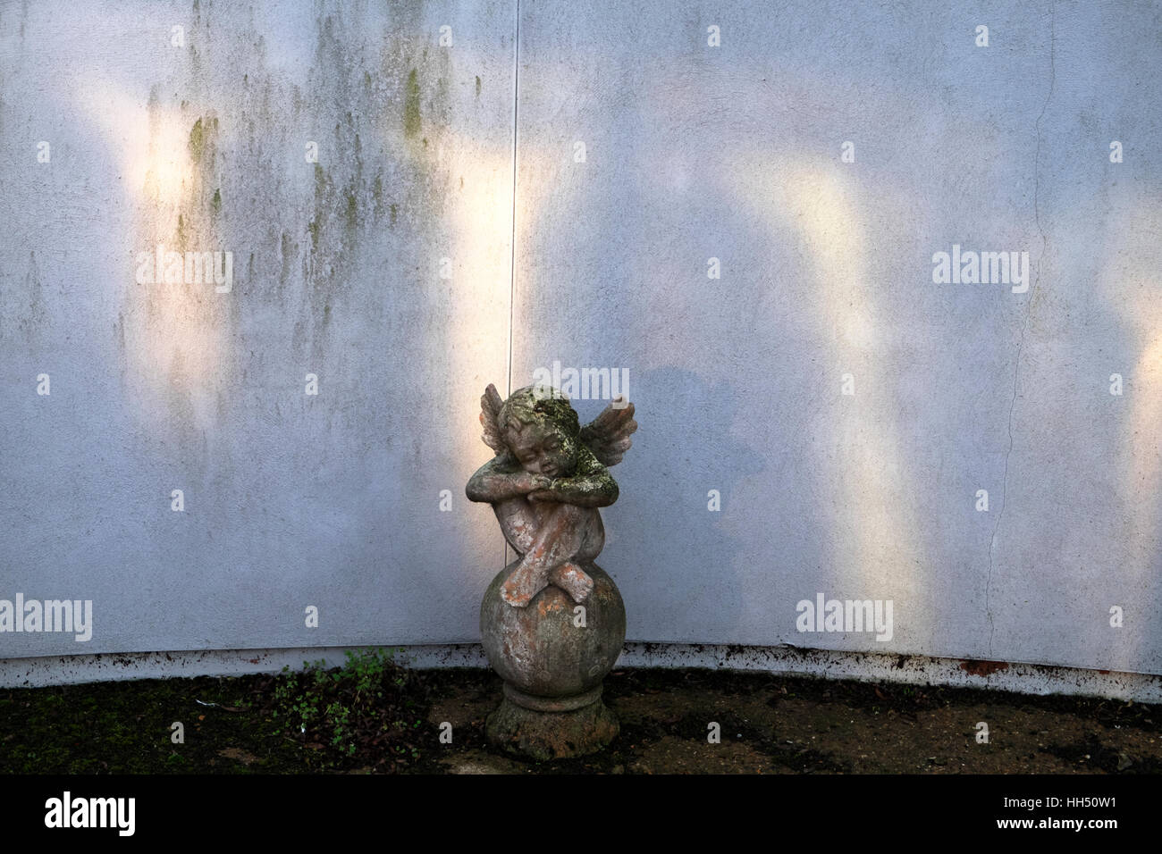 Cherub garden statue Stock Photo - Alamy