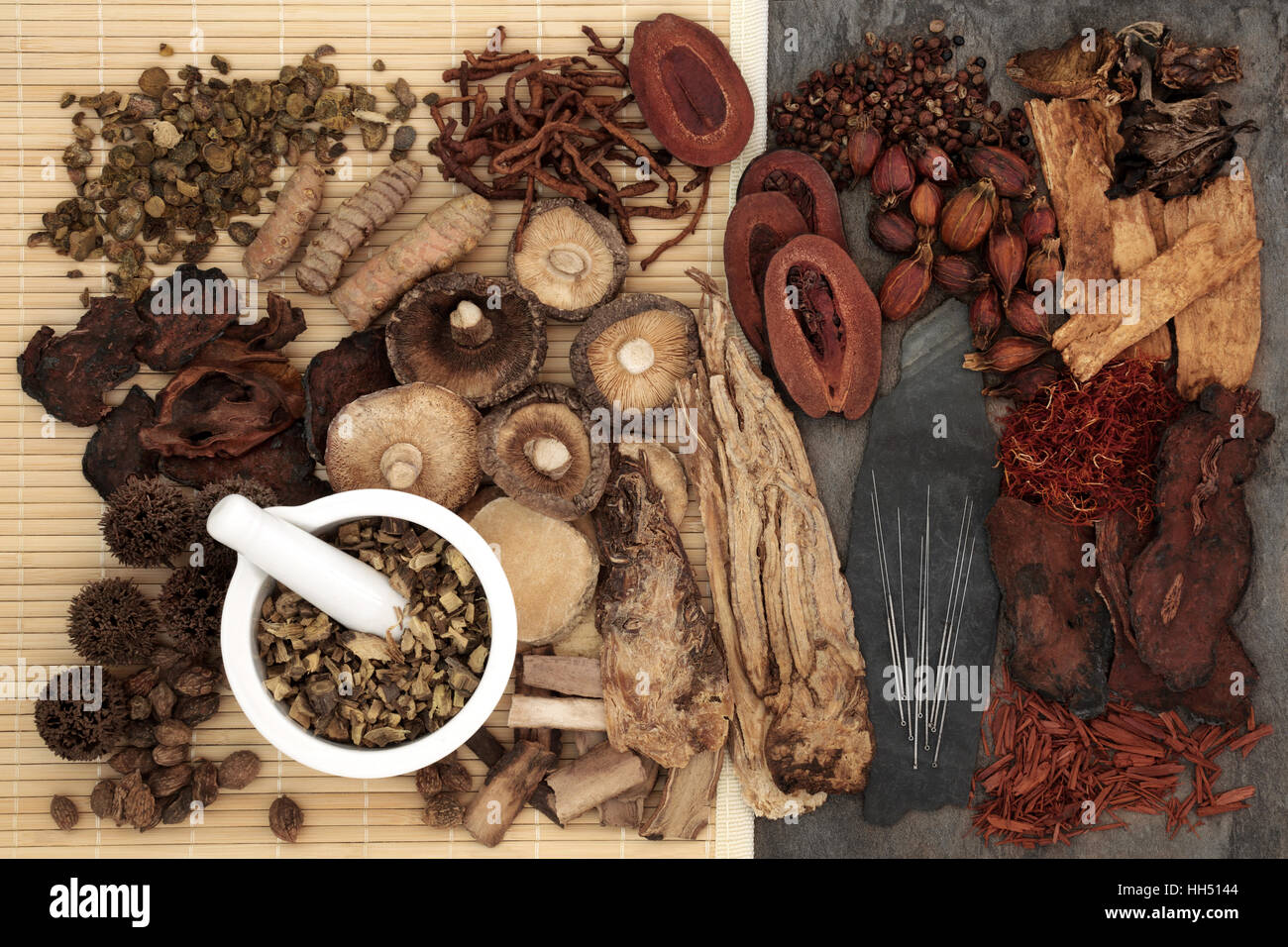 Traditional chinese herbal medicine selection with acupuncture needles ...