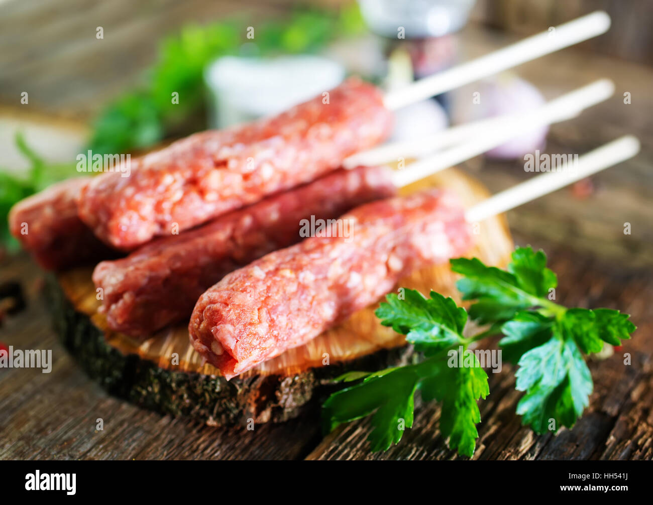 raw kebab on board and on a table Stock Photo - Alamy