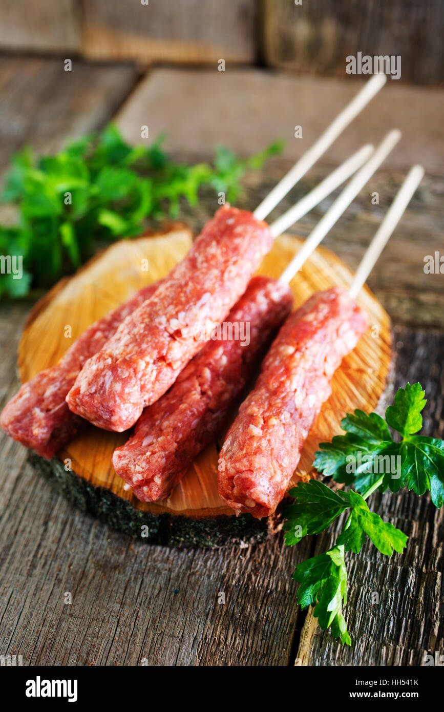 raw kebab on board and on a table Stock Photo - Alamy