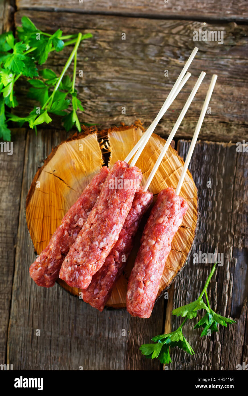 raw kebab on board and on a table Stock Photo - Alamy