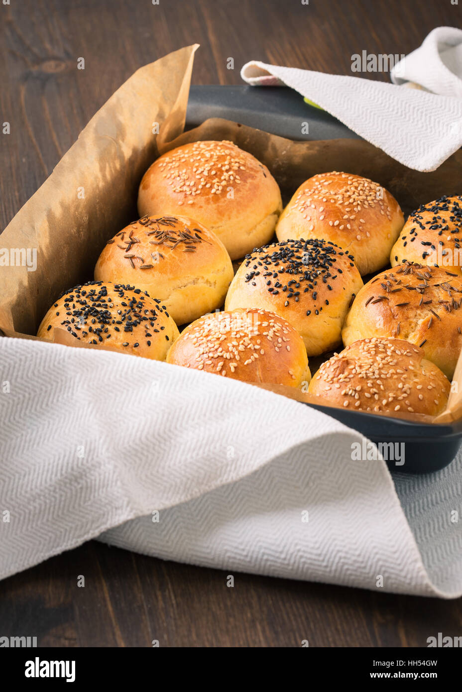 Homemade tasty buns with sesame and cumin on tray Stock Photo - Alamy