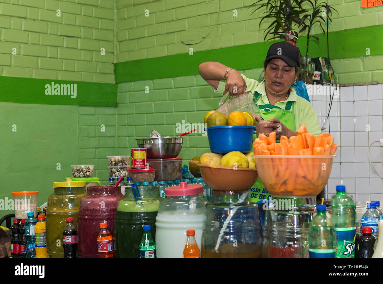 Vendor of freshly pressed fruit juice, Inaquito Market food court ...