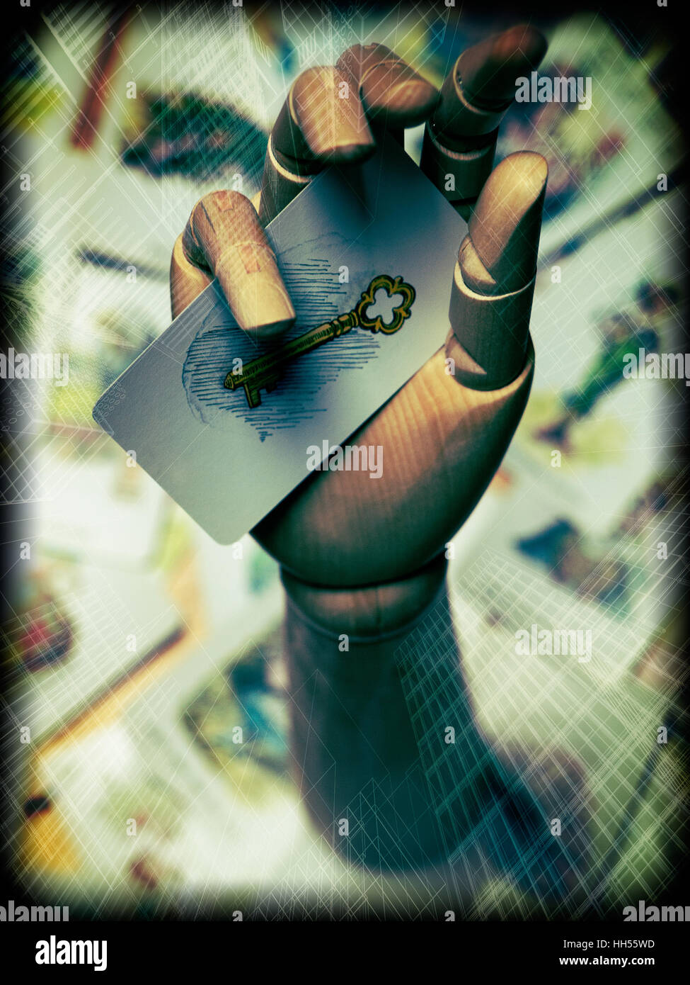 Artist's wooden hand holding Tarot card Stock Photo - Alamy