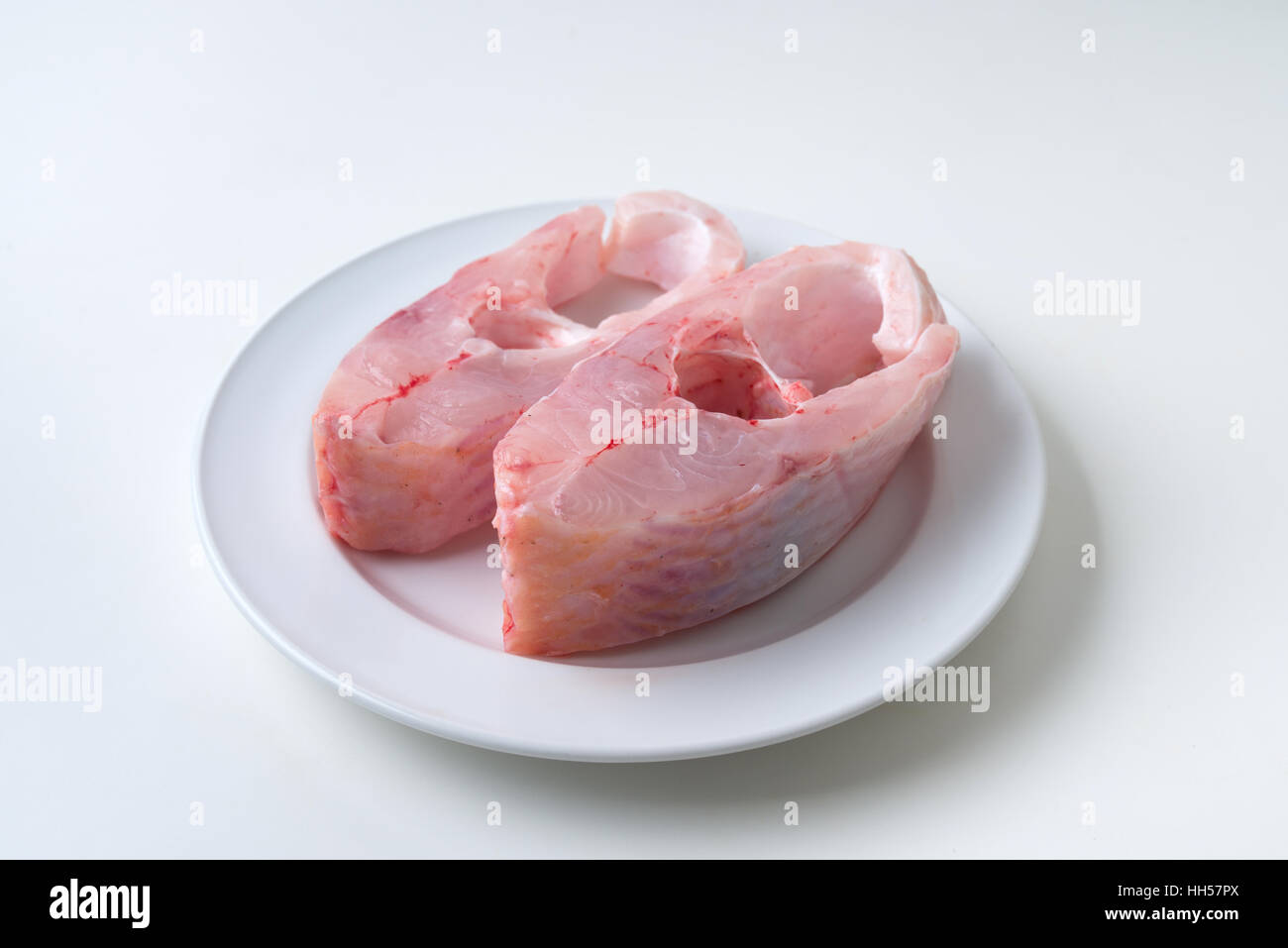 slice pomegranate fish on a disc Stock Photo - Alamy