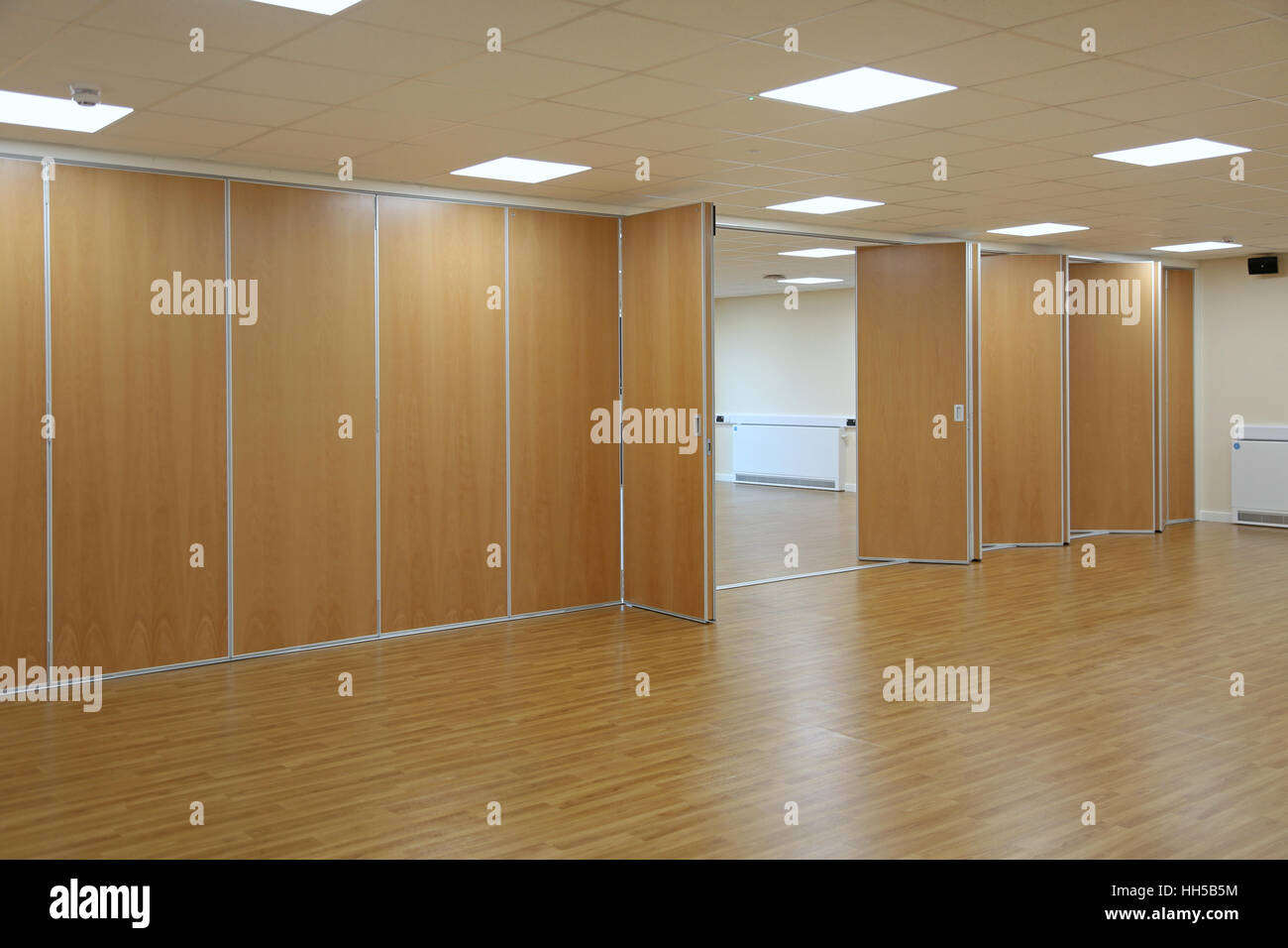 a folding,sliding acoustic partition in use in a new school hall in ...