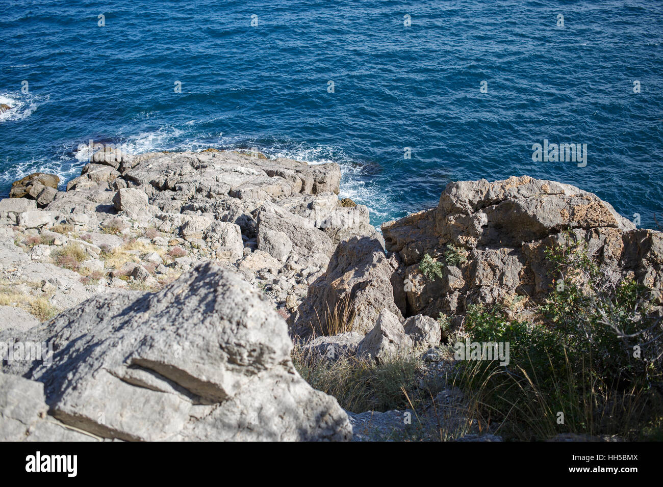 Sea bay with clear blue water Stock Photo - Alamy