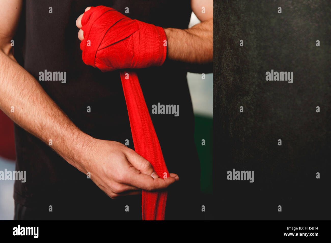 Male puts on boxing bandages Stock Photo - Alamy