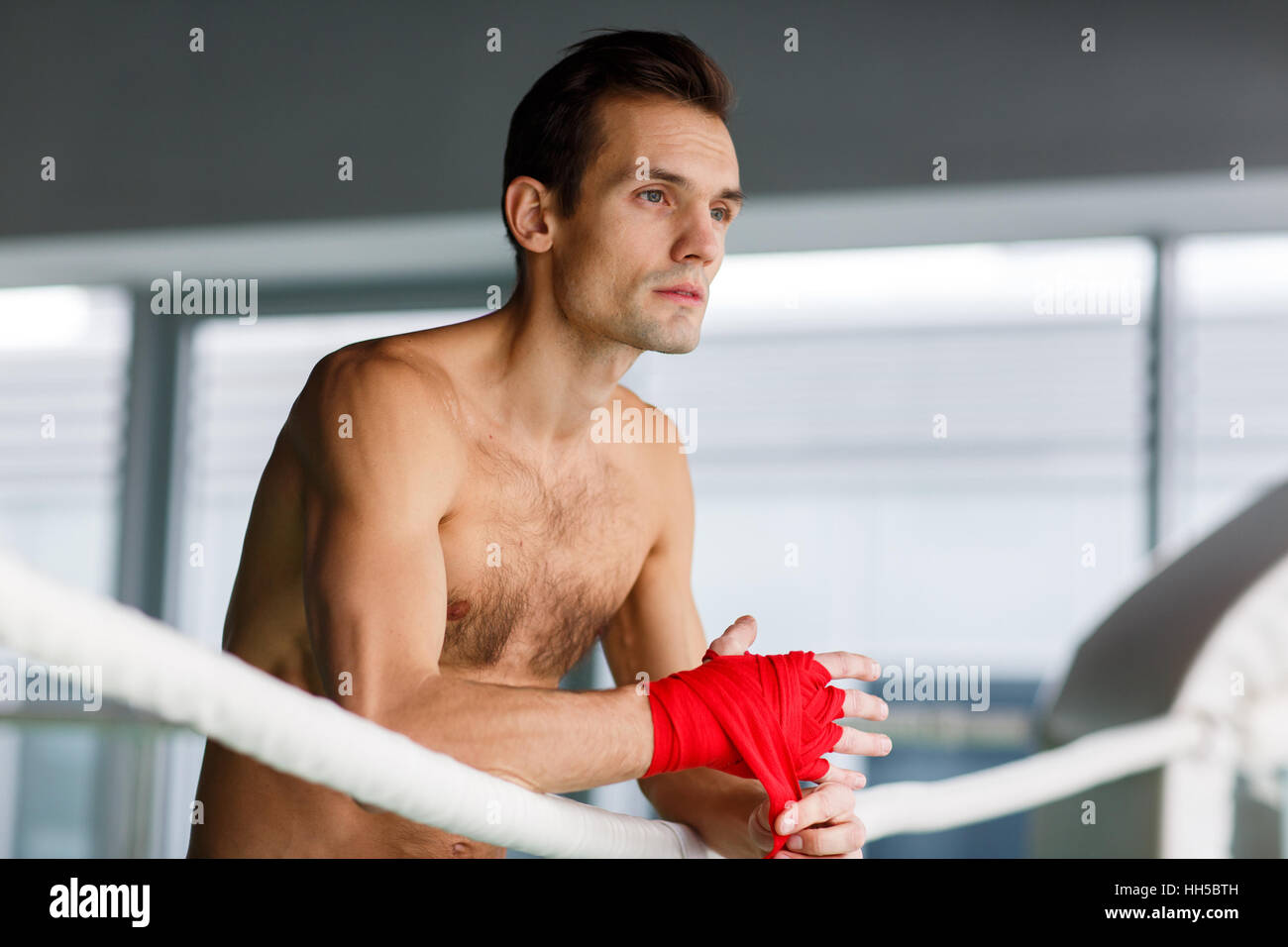 Young man in boxing ring Stock Photo - Alamy