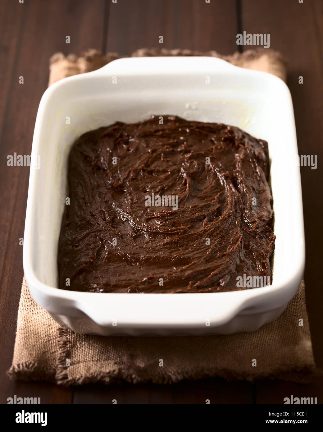 Basic homemade brownie or chocolate cake dough in greased and floured ...