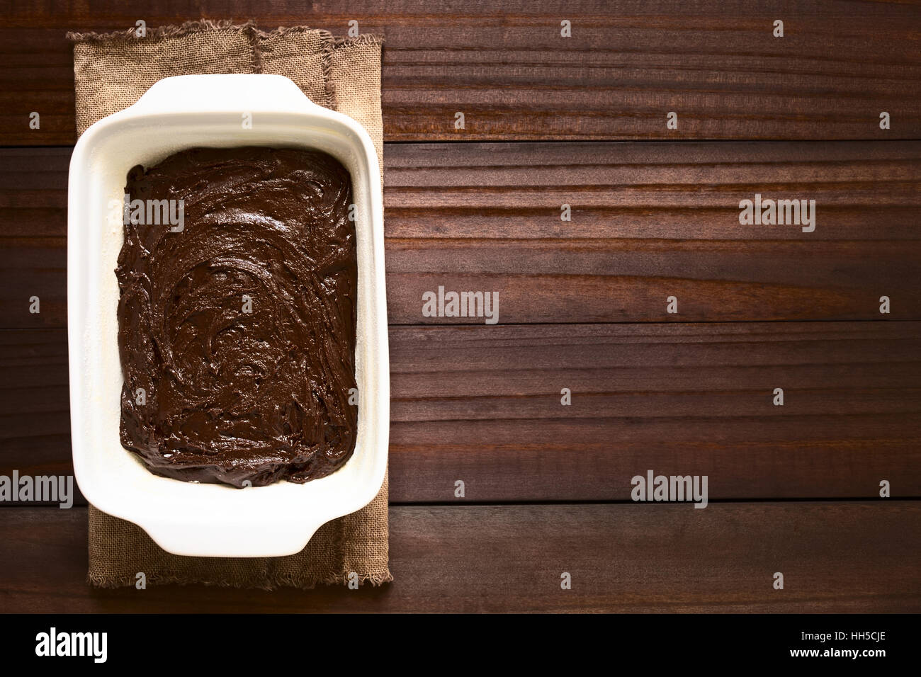 Basic homemade brownie or chocolate cake dough in greased and floured ...