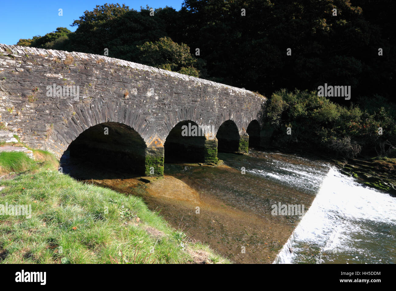 A bridge with four arches over the River Fal at Ruan Lanihorne ...