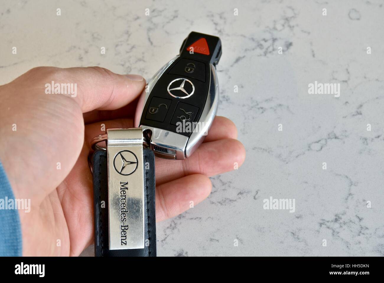 Holding Mercedes-Benz keys in hand Stock Photo - Alamy