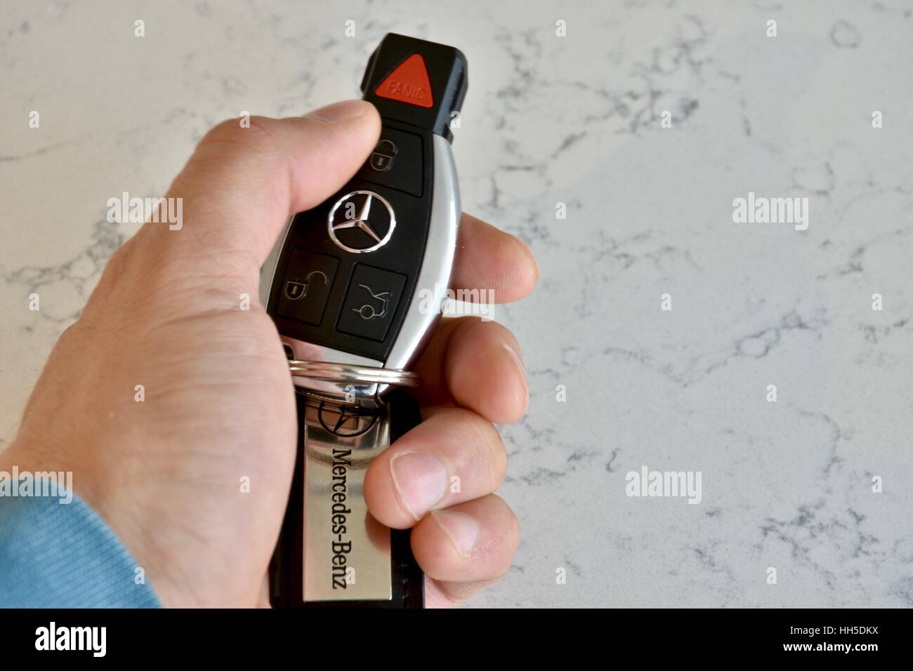 Holding Mercedes-Benz keys in hand Stock Photo - Alamy