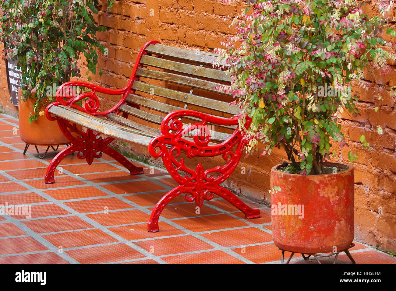 Patio Bench flanked by potted flowers, Salento Colombia Stock Photo - Alamy