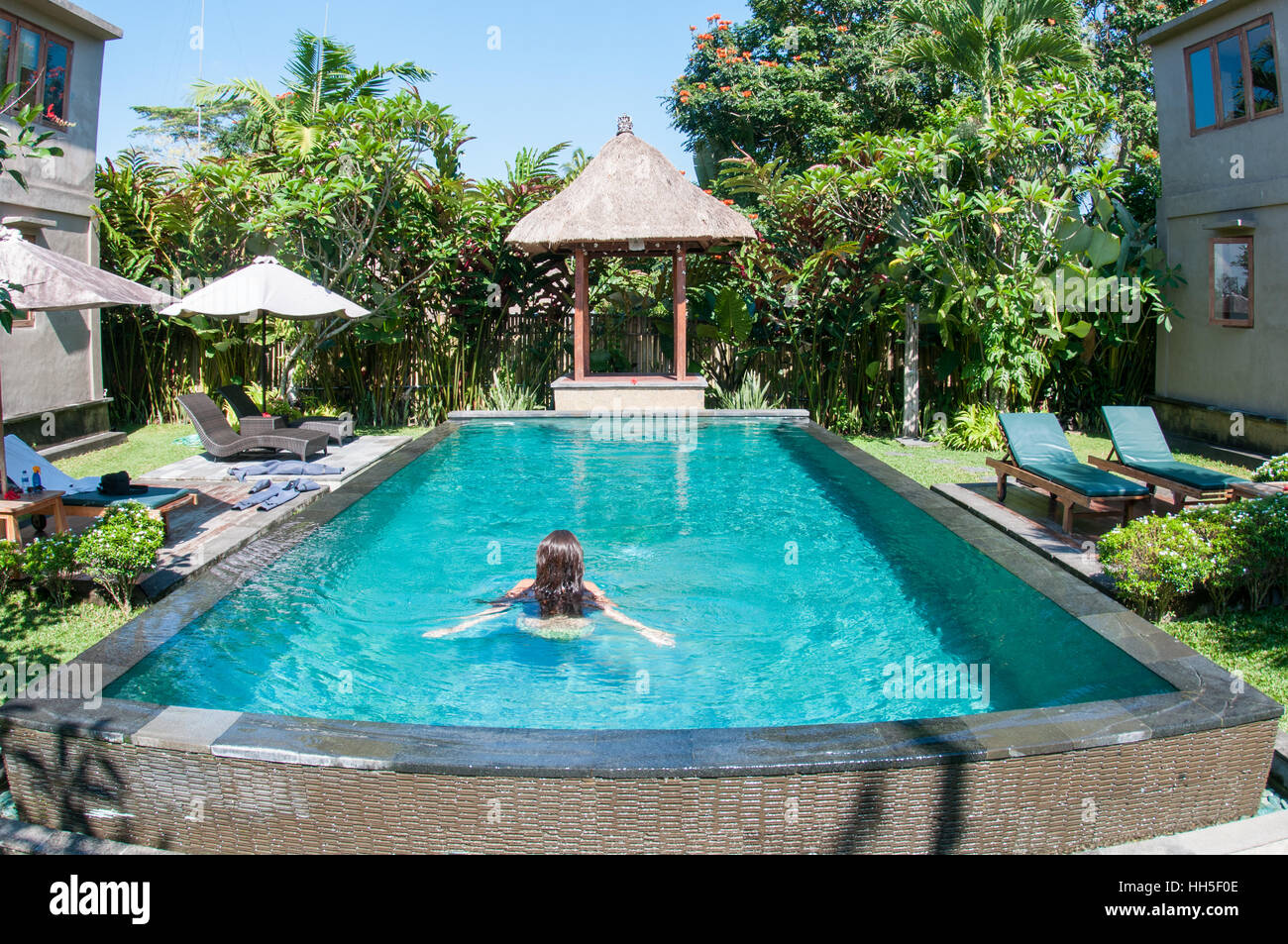 Woman swimming in a pool, Ubud, Bali, Indonesia Stock Photo - Alamy