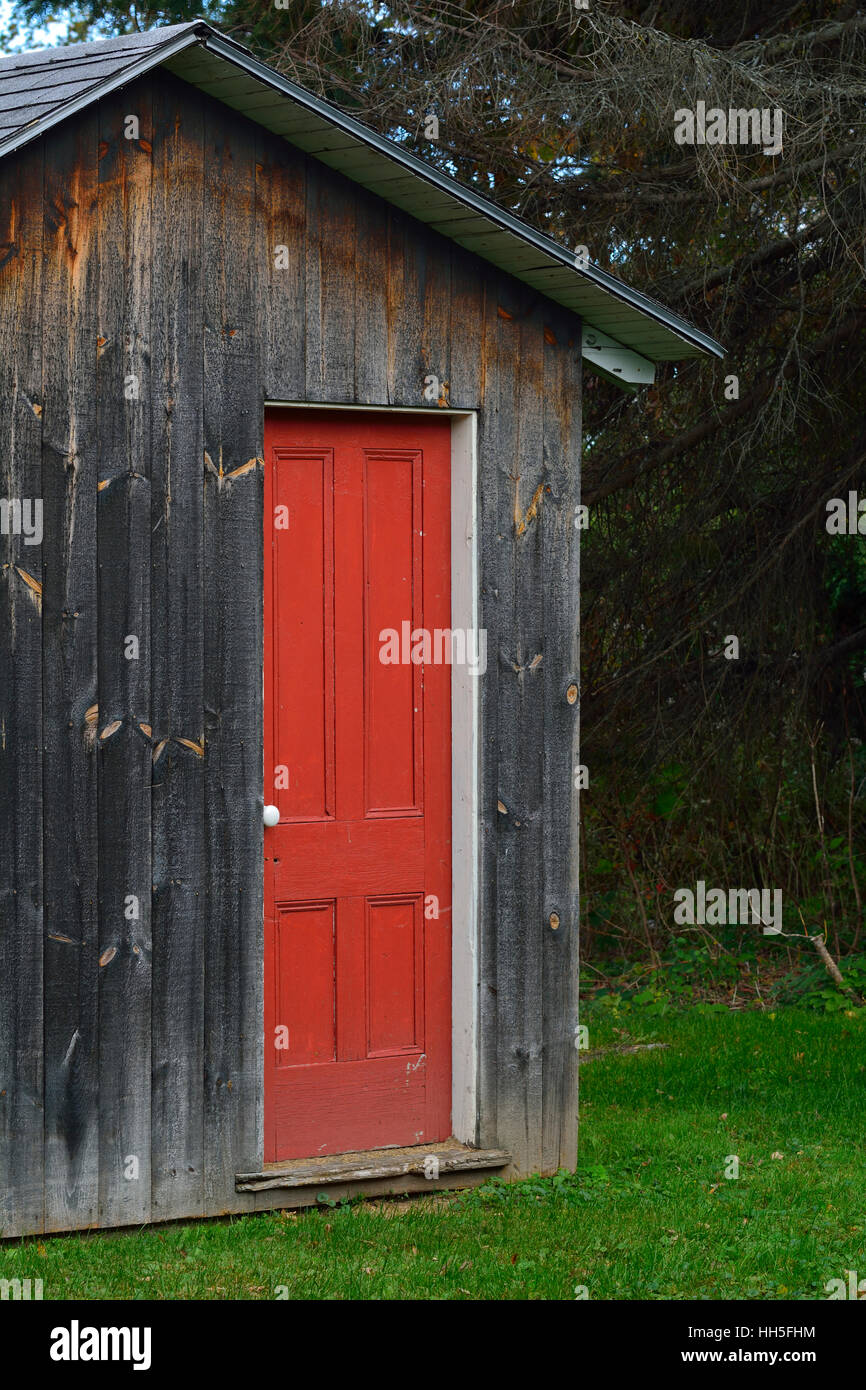 Old shed with red door Stock Photo - Alamy