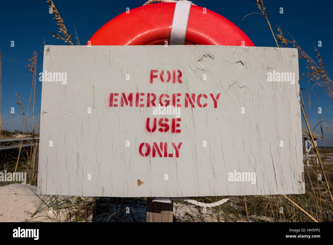 For Emergency Use Only Sign on Life Buoy with aged sign Stock Photo - Alamy