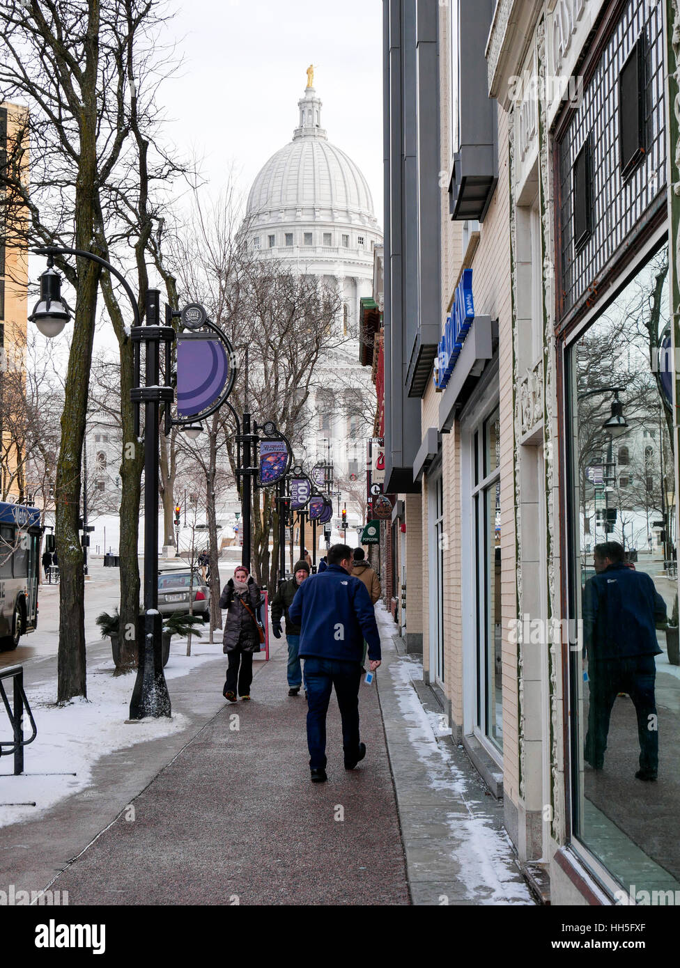 State Street in winter, Madison, Wisconsin. State capitol in background ...